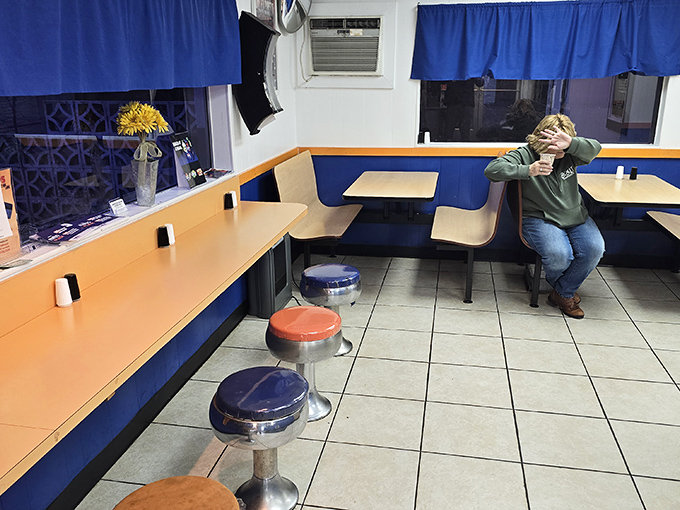 Colorful stools and cozy booths invite you to sit back and enjoy your meal in this bright, local dining space.