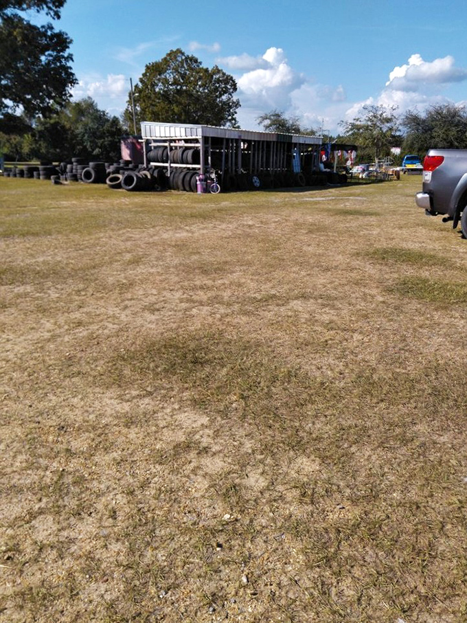 Where tires go to find their second calling. The market sprawls beyond the pavilions into fields of possibility.