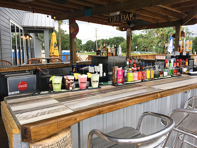 The Tiki Bar – where island vibes meet Florida fishing camp. Those colorful bottles aren't just for show; they're liquid sunshine waiting to happen.