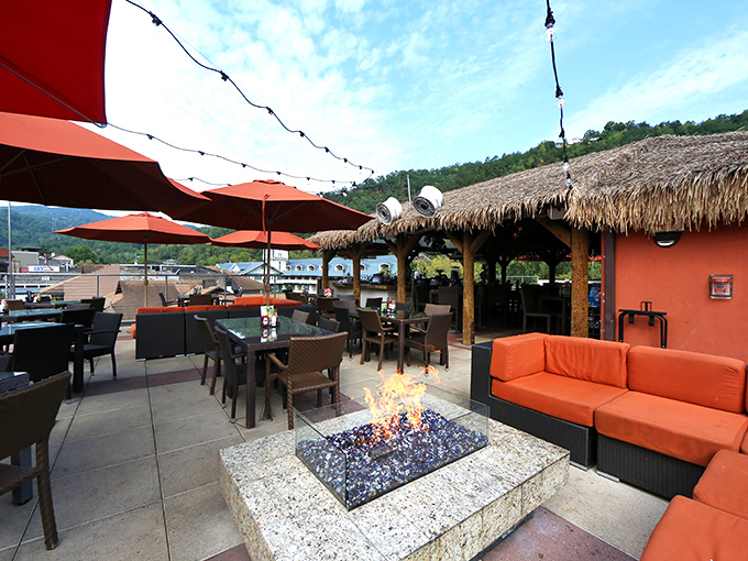 The rooftop patio combines mountain views with fiery ambiance, where conversations flow as freely as the margaritas under Tennessee skies.