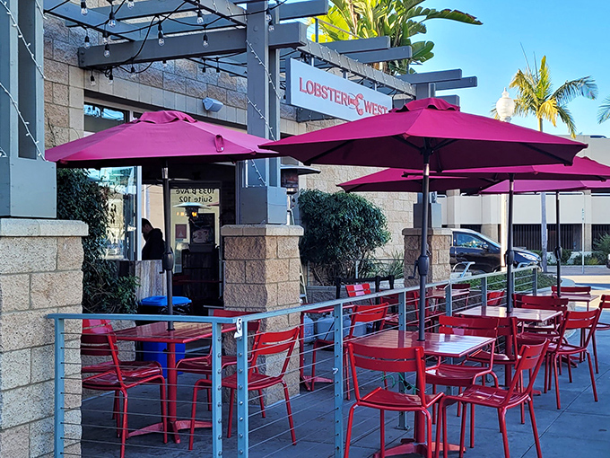 Magenta umbrellas and signature red chairs create the perfect outdoor dining scene. California sunshine meets East Coast flavors&mdash;a bicoastal romance we can all get behind.