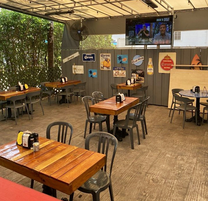 Outdoor seating for those rare moments when Miami isn't trying to melt you&mdash;beer signs included for proper hydration guidance.