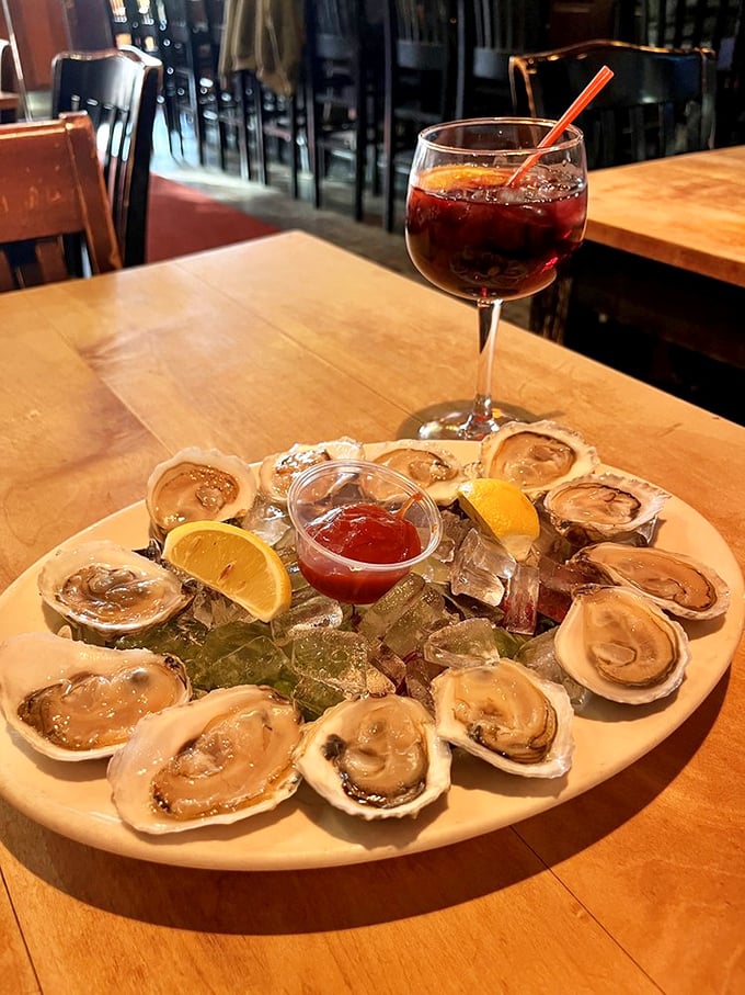 Oysters on ice, looking like they were plucked from the sea moments ago, with a glass of sangria playing the perfect supporting role.