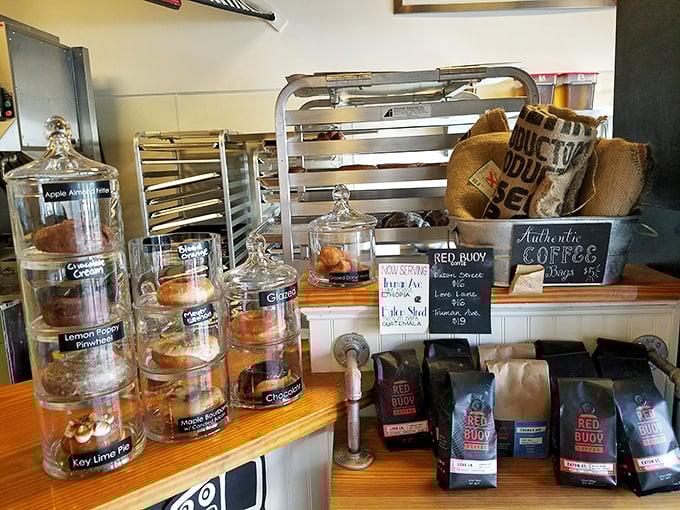 Glass jars of temptation line the counter, each containing a different path to donut nirvana.