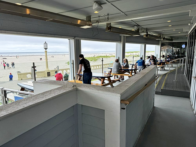 Outdoor seating that puts you front-row for nature's greatest show: the mighty Pacific, complete with beach-goers providing the opening act.