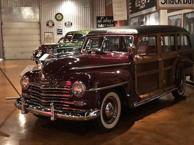 This burgundy Plymouth woody wagon isn't just transportation&mdash;it's a mahogany-trimmed time machine ready to carry your family to a 1940s beach picnic.