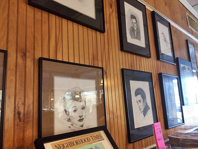 The wall of vintage portraits adds character, as if saying "people have been enjoying good meals here for generations."