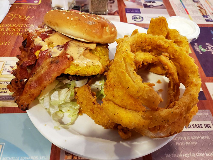 The onion rings are wearing their golden formal attire while the burger shows up with bacon suspenders. Talk about a power couple!
