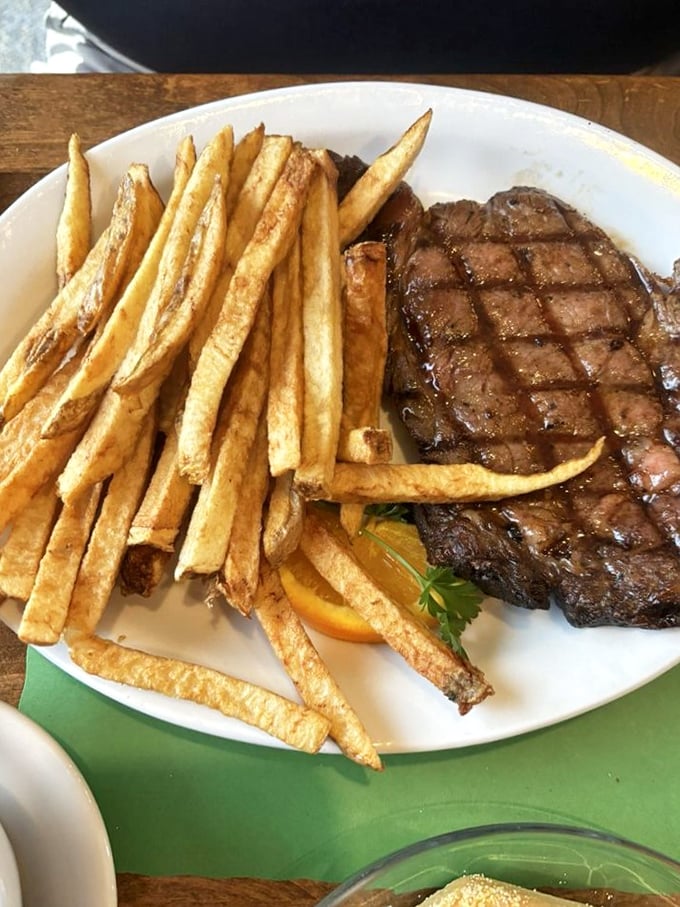This steak isn't just grilled&mdash;it's been given a philosophy about life, complete with perfect diamond grill marks and golden fries.