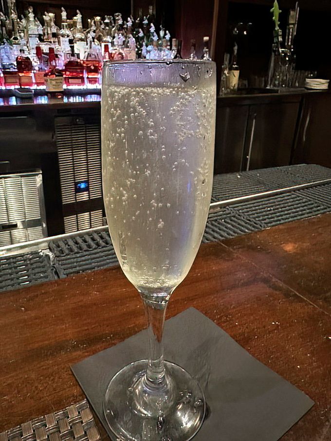 Bubbles dance in crystal flutes, because some meals deserve sparkling accompaniments that make ordinary evenings feel like celebrations.