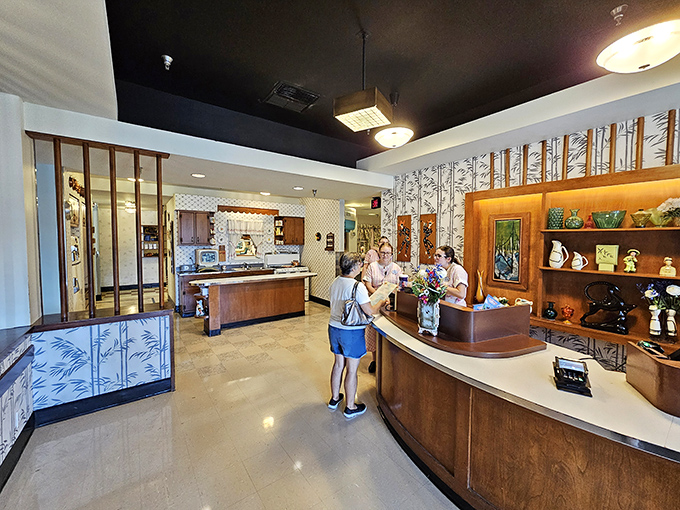 The reception area feels like checking into a 1950s sitcom, where problems are solved in 30 minutes and dessert always follows dinner.