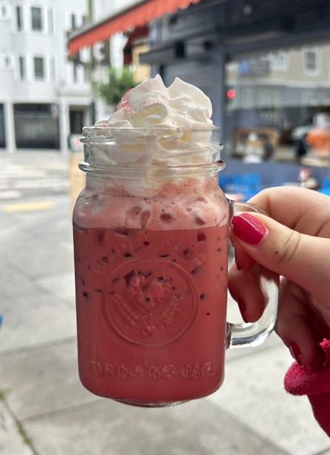 A mason jar of ruby-red refreshment topped with clouds of whipped cream &ndash; because sometimes breakfast calls for something beyond the coffee spectrum.