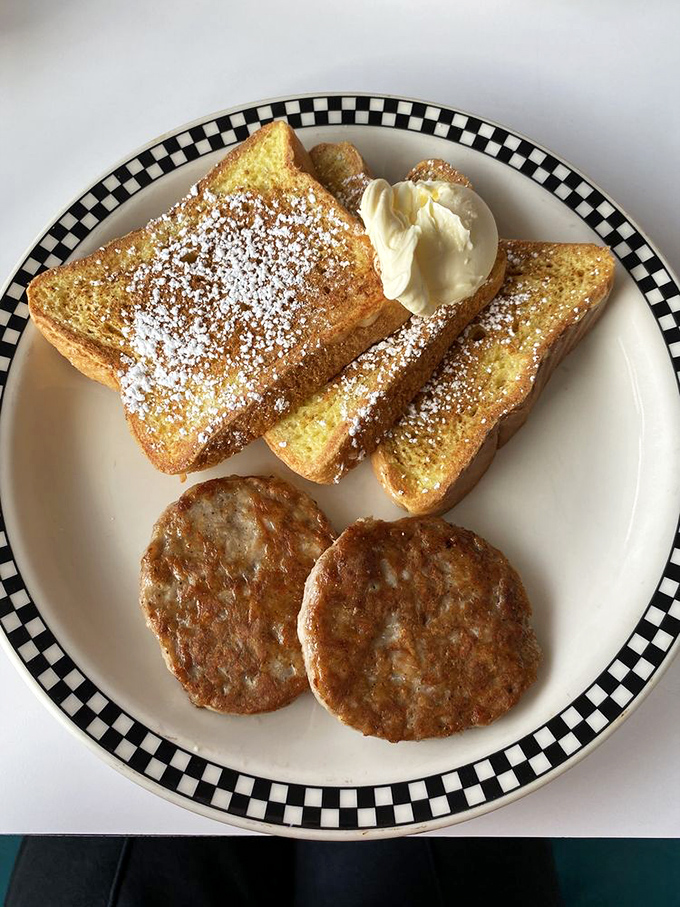 French toast dusted with powdered sugar alongside sausage patties &ndash; the breakfast equivalent of wearing both a tuxedo and comfortable shoes.