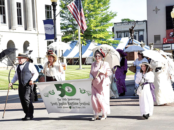 The Scott Joplin Ragtime Festival parade brings history to life with period costumes and parasols that would make the King of Ragtime himself smile.