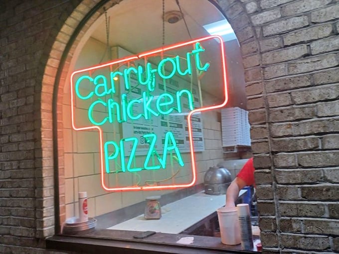 The neon "Carry-out" sign glows like a beacon of hope for those nights when cooking feels like climbing Everest in flip-flops.