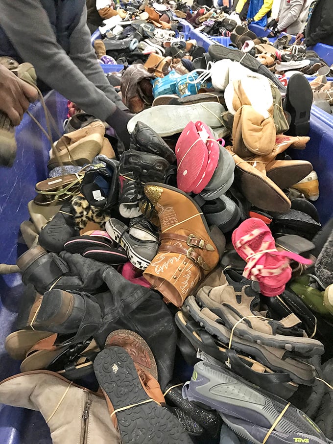 The footwear bin resembles a surrealist sculpture&mdash;hundreds of single shoes hoping to reunite with their partners in shopper paradise. 