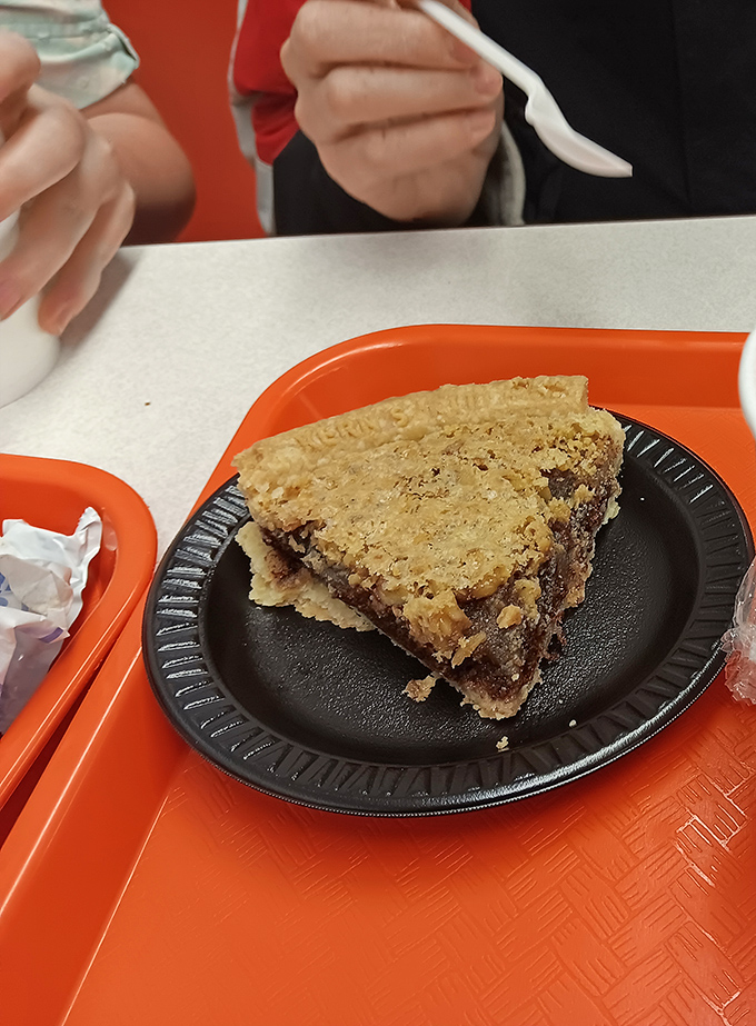 This slice of pie isn't just dessert—it's edible architecture with layers of flavor that would make any grandma nod in approval.