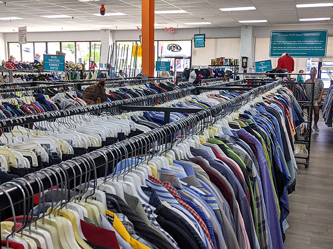 The men's section stretches toward infinity. Those color-coordinated shirts create a rainbow effect that would make any organization guru weep with joy.