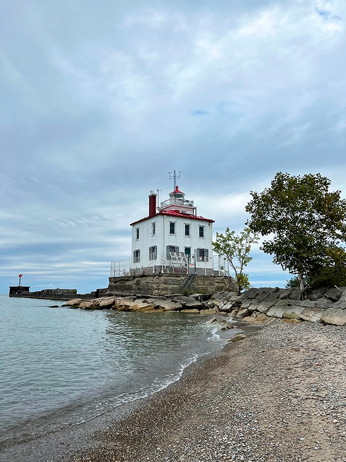 The lighthouse stands sentinel against moody skies, proving that even on cloudy days, this Great Lakes landmark delivers postcard-worthy drama.