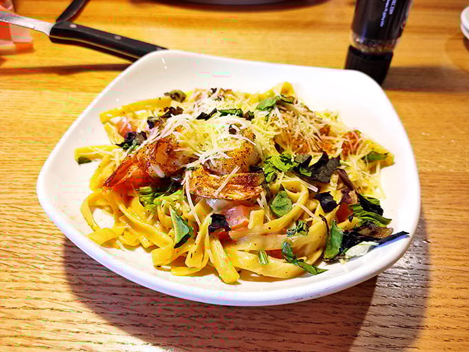 Pasta that doesn't pretend to be Italian but instead embraces its American steakhouse identity with plump shrimp and generous cheese.