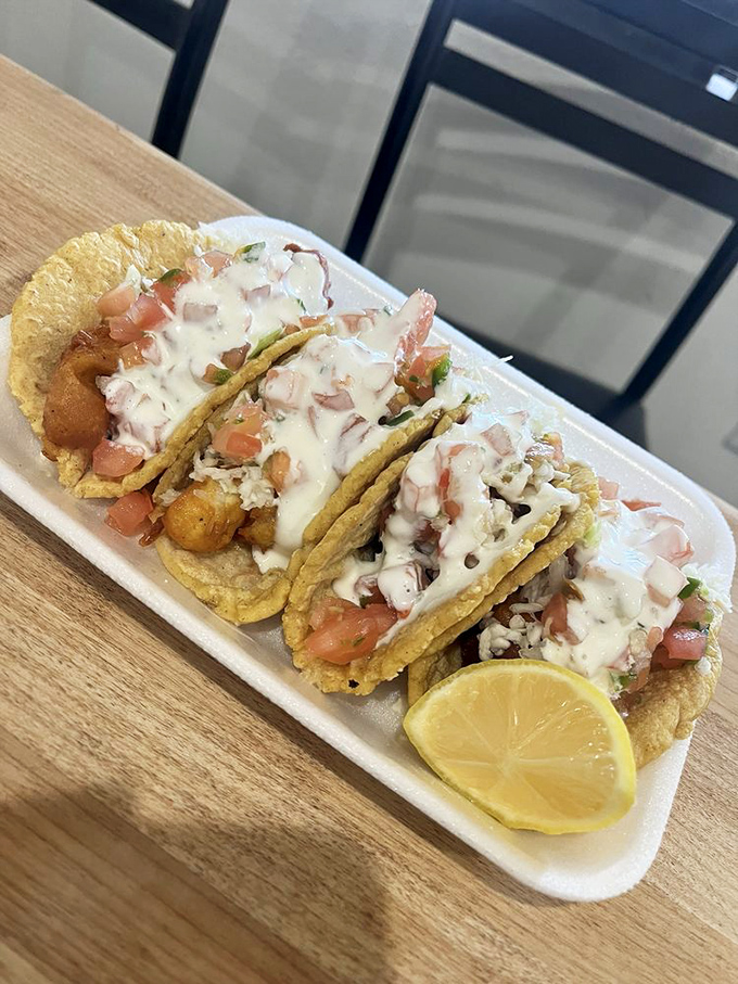 Shrimp tacos dressed to impress with crisp vegetables and a drizzle of sauce that makes you wonder why you ever ate anything else.