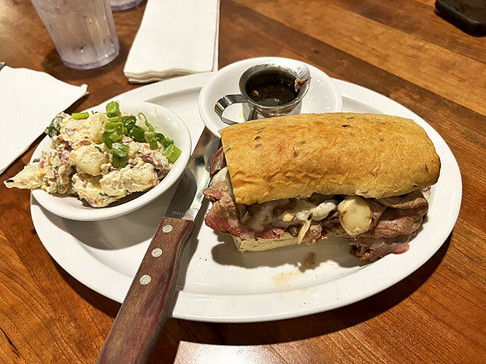 A sandwich that means business&mdash;tender prime rib nestled in a fresh roll, accompanied by a potato salad that grandmothers everywhere would approve of.