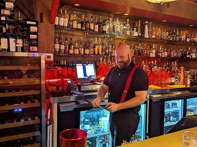 Behind every great steakhouse is a passionate team. The red suspenders add a touch of old-world charm to modern service excellence. 