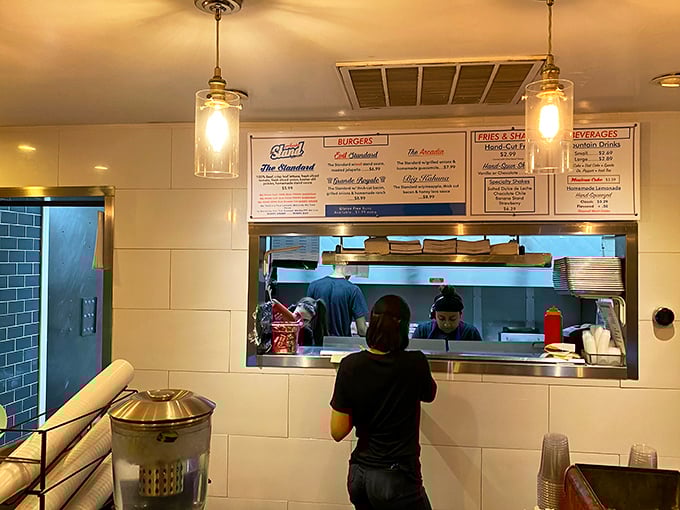 A glimpse into the kitchen where burger magic happens&mdash;no smoke and mirrors, just dedicated folks turning simple ingredients into edible joy.