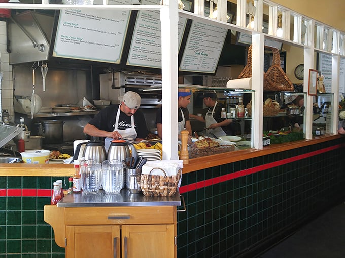 Where the magic happens. The semi-open kitchen design isn't just practical&mdash;it's dinner theater for breakfast, with the sizzle as soundtrack.