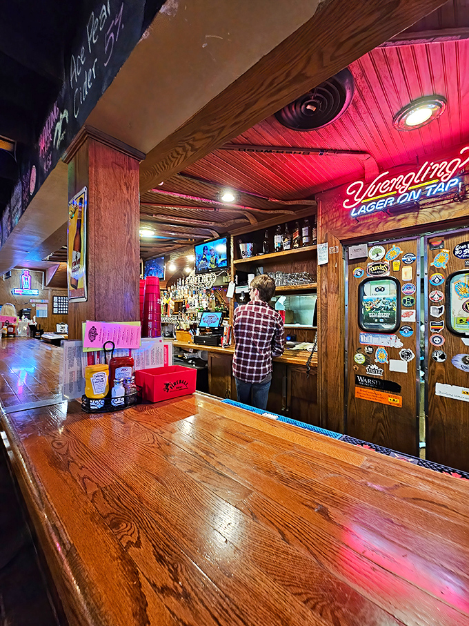 The warm glow of neon signs bathes the bar in nostalgic light. This is where Oxford's thirst meets its match. 