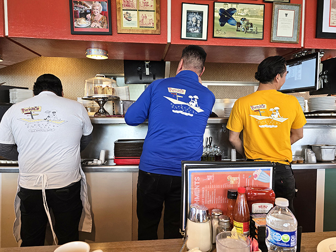 The kitchen crew in their matching shirts move with the choreographed precision of people who know breakfast is serious business.