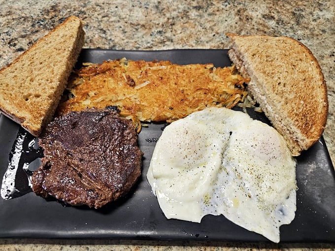 The holy trinity of breakfast: perfectly cooked steak, eggs with just-right yolks, and hash browns crisped to golden perfection. This plate doesn't need fancy - it has flavor.