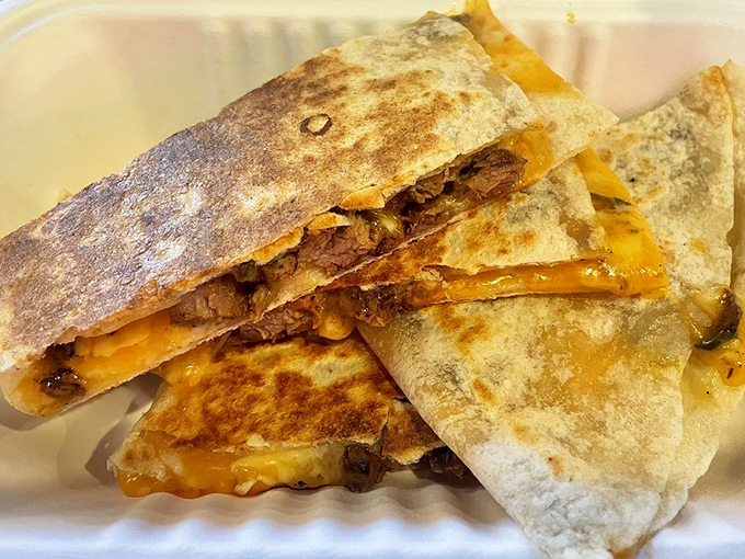 Steak quesadilla segments stacked like delicious dominoes. The cheese pull potential here would make any food influencer reach for their phone.