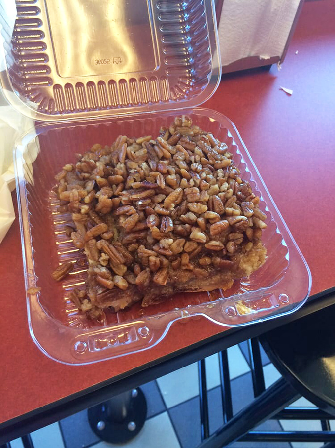 Not just a sticky bun, but a pecan-studded island floating in a sea of caramel that would make even the strictest dietitian temporarily abandon their principles.