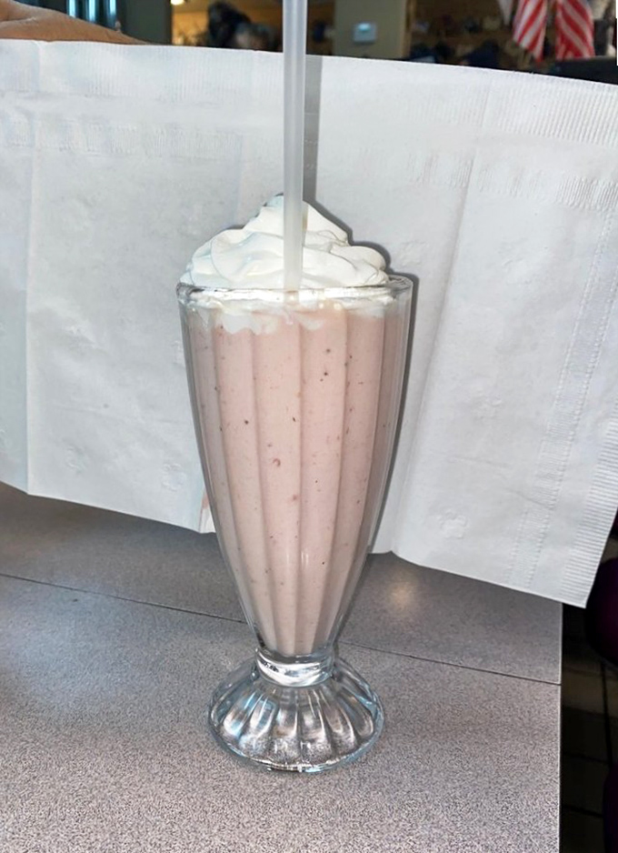 A strawberry shake topped with whipped cream that stands tall and proud, like the Bellagio fountains but infinitely more delicious.