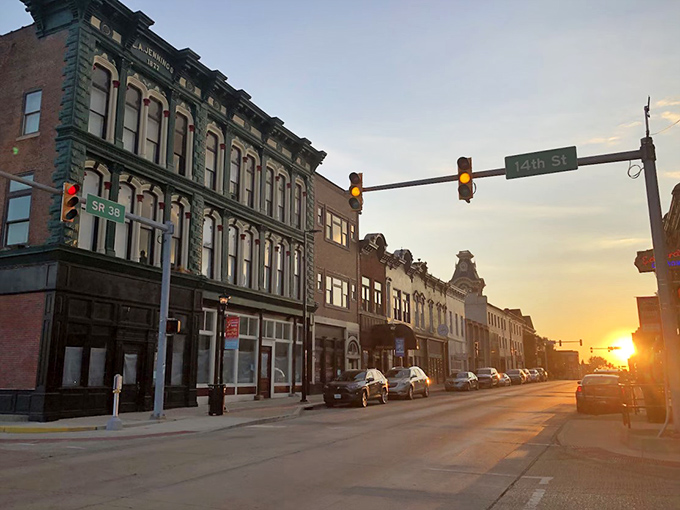 Sunset bathes downtown in golden light, transforming ordinary brick buildings into something that belongs on a postcard or your social media feed.