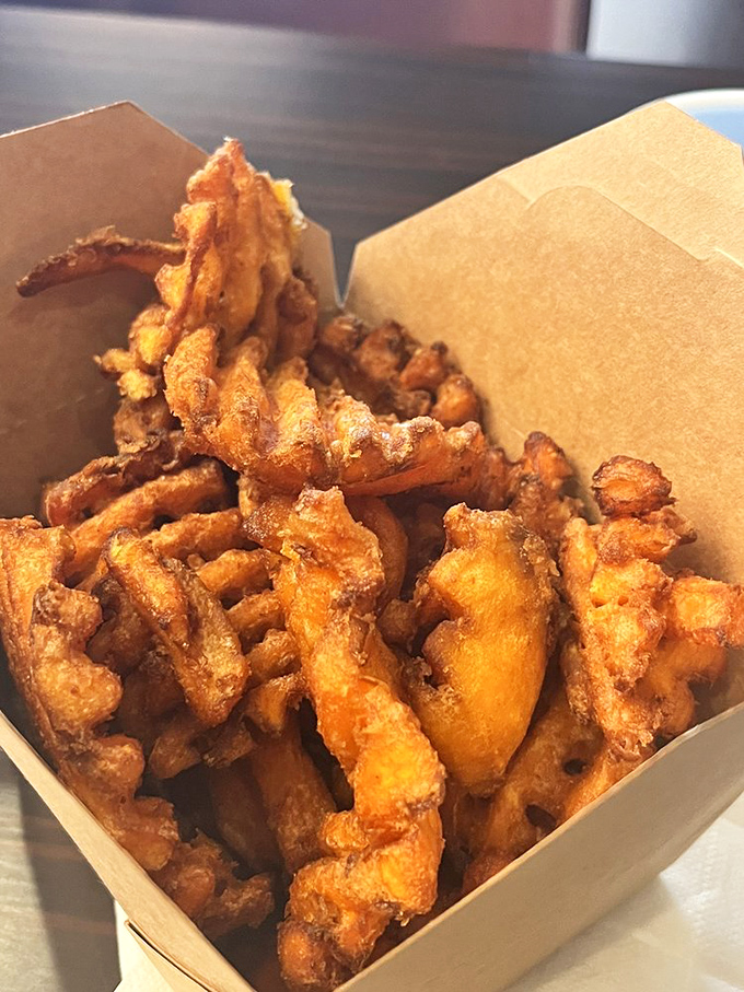 These aren't just sweet potato fries; they're golden tangles of crispy joy that make regular fries look like they're not even trying.