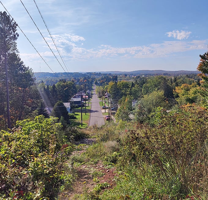 From Tank Hill, Ironwood unfolds like a storybook town, nestled among forests that stretch to the horizon and beyond.