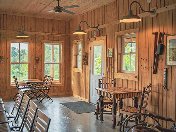 Rustic wooden walls frame windows that showcase the vineyard beyond. Inside meets outside in perfect harmony, like a good wine pairing.