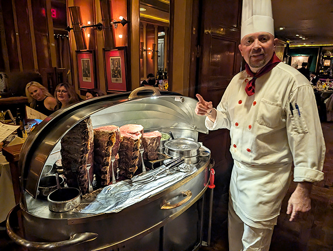 The silver cart ceremony in action, where prime rib is carved with the precision of a Swiss watchmaker. This is dinner and a show.