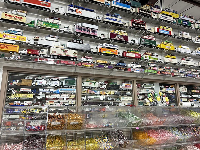 A fleet of candy delivery vehicles watches over the bulk bins below. Sweet cargo has never looked so meticulously organized.