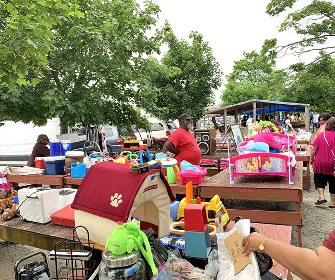 Childhood nostalgia spills across outdoor tables where forgotten toys await their chance to delight a new generation.
