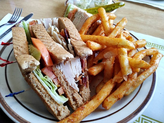 The club sandwich&mdash;architecture you can eat. Layers of satisfaction served with fries that clearly went to finishing school.