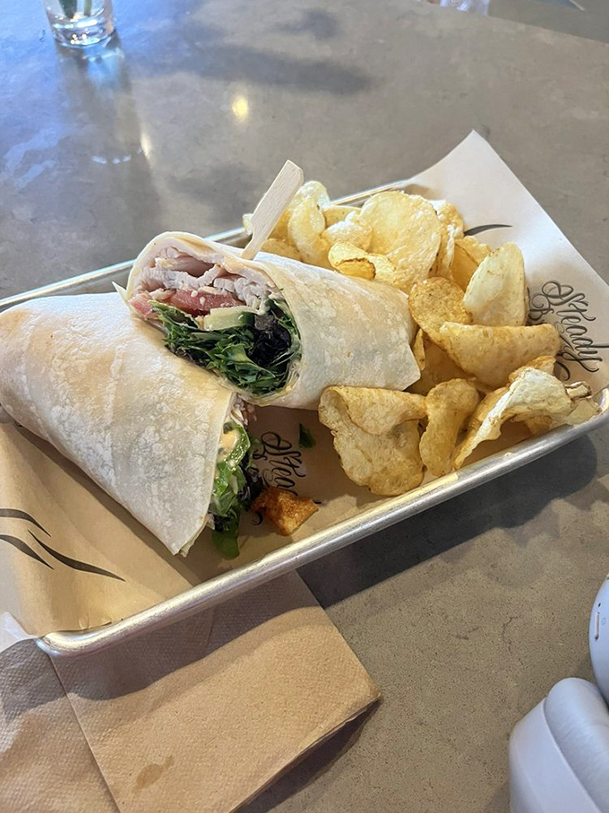 This wrap doesn't just hold ingredients&mdash;it embraces them in a tortilla hug alongside chips that clearly know they're the supporting actors.