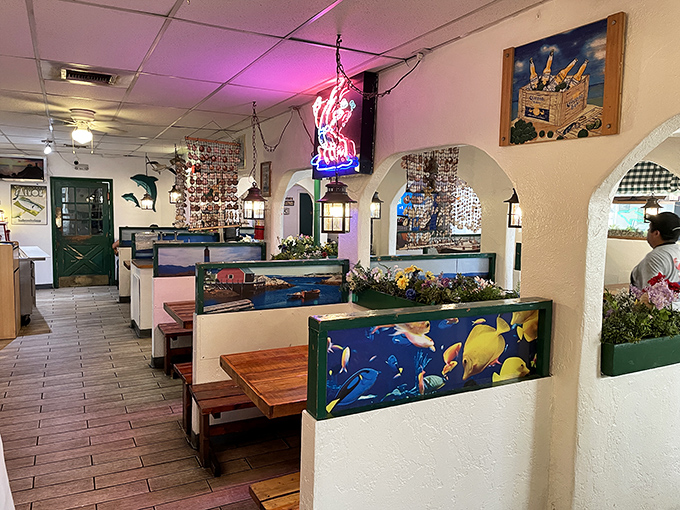 Booth dividers adorned with underwater scenes create the illusion of dining beneath the waves, 300 miles from the nearest ocean.