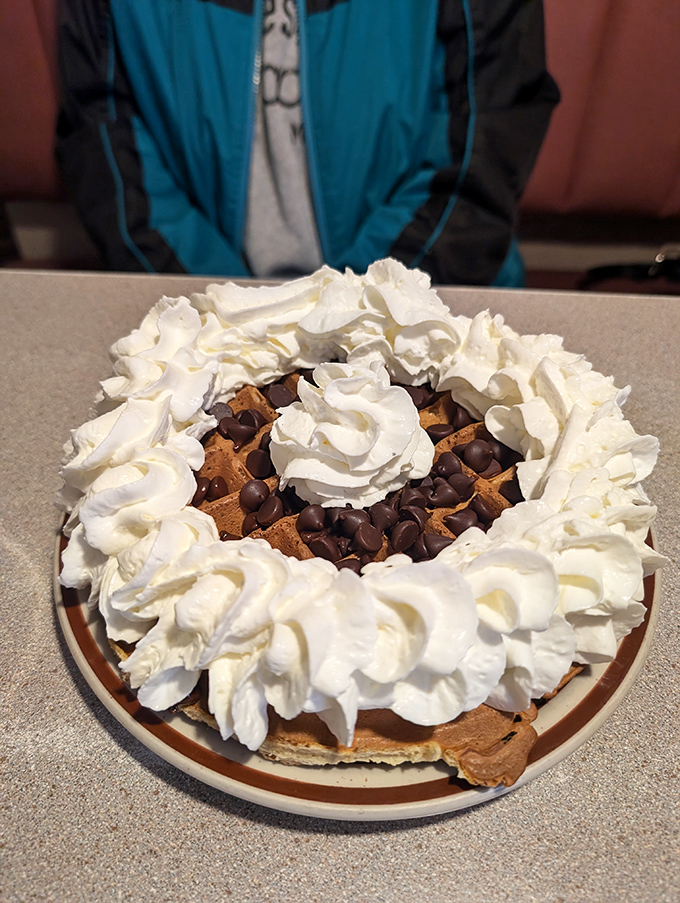 Not just dessert, but breakfast royalty &ndash; a chocolate chip waffle crowned with whipped cream that would make any birthday cake jealous.