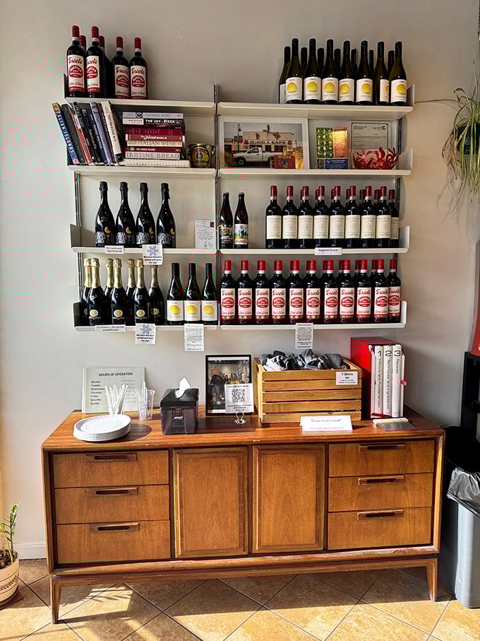 A wine selection that means business. These bottles aren't just decoration&mdash;they're carefully chosen companions for your pizza journey.