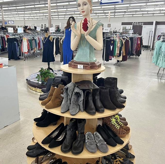 The mannequin presides over her shoe kingdom like a fashionable deity. Those leopard print flats are practically begging for a night out!