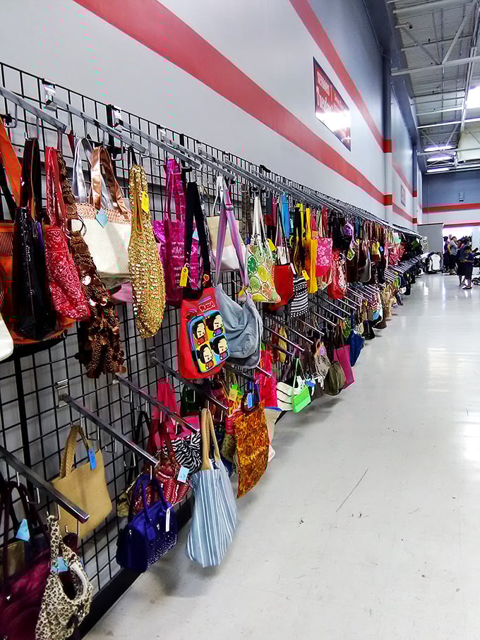 A rainbow explosion of handbags dangles from display walls, proving that yesterday's fashion statements can still speak volumes today.