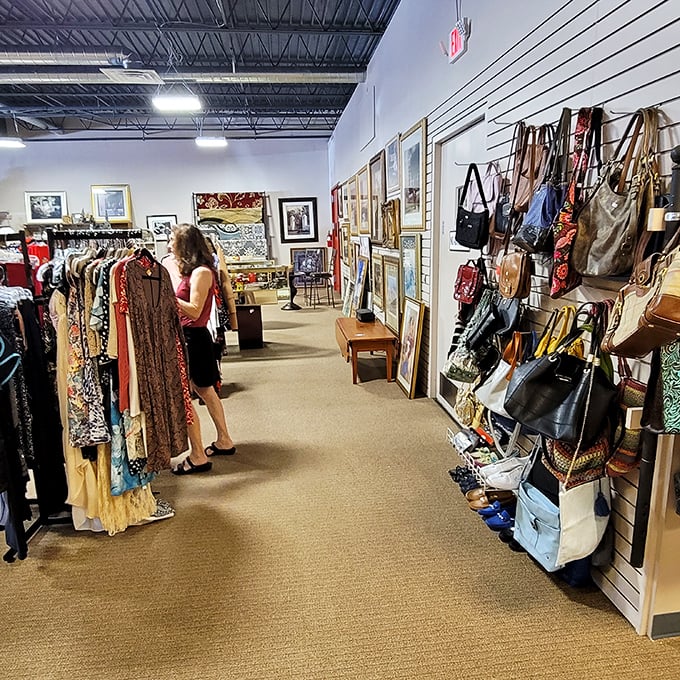 The handbag corridor: where designer dreams meet practical budgets. That wall of purses contains more stories than a Netflix series.